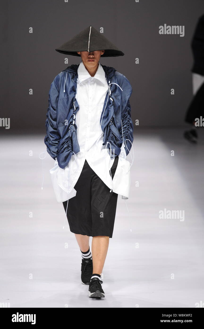 A model displays a new creation from the Beijing Institute of Fashion ...