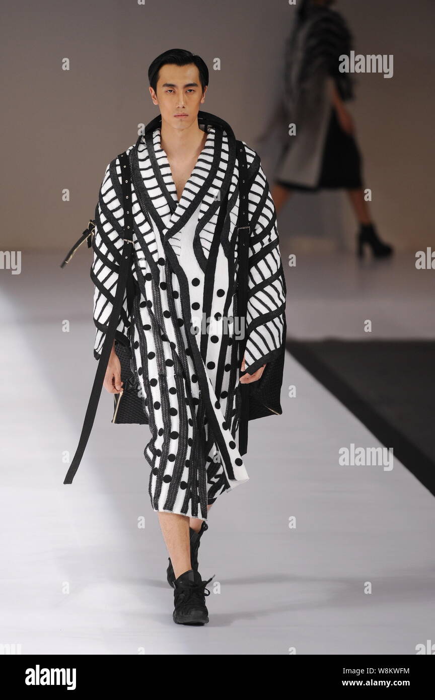A model displays a new creation from the Beijing Institute of Fashion ...