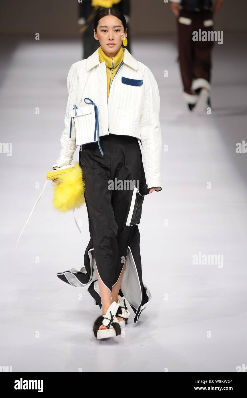 A model displays a new creation from the Beijing Institute of Fashion ...