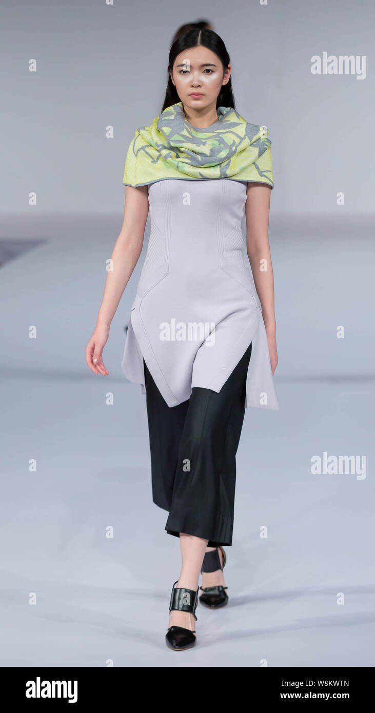 A model displays a new creation by Chinese designer Guo Ruiping at the ...
