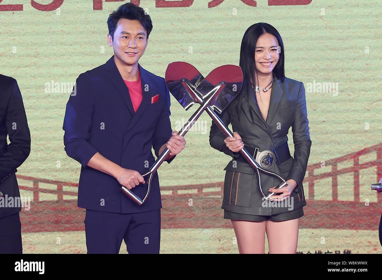 Chinese actress Yao Chen, right, and actor Li Chen pose with shovels at ...