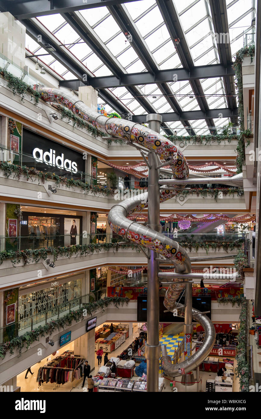 View of a five-story high giant winding slide in a shopping mall in ...