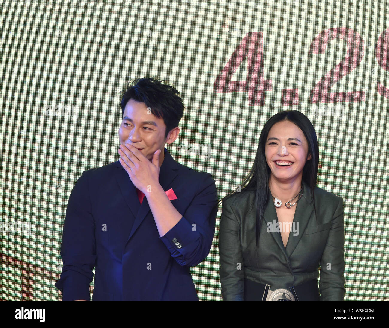 Chinese actress Yao Chen, right, and actor Li Chen react at a press ...