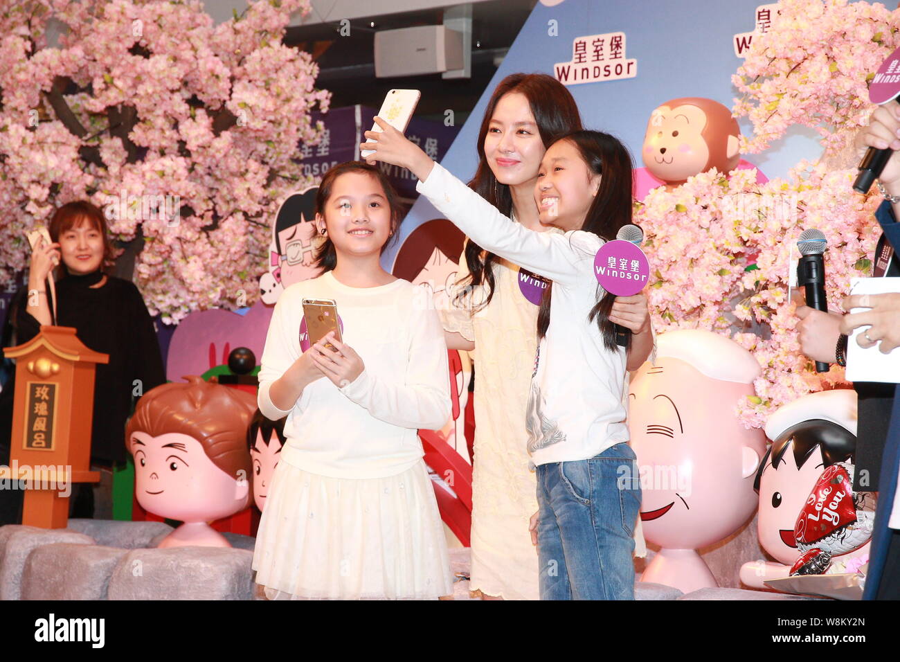 South Korean actress Cheon Seong-im, center, better known by her stage ...