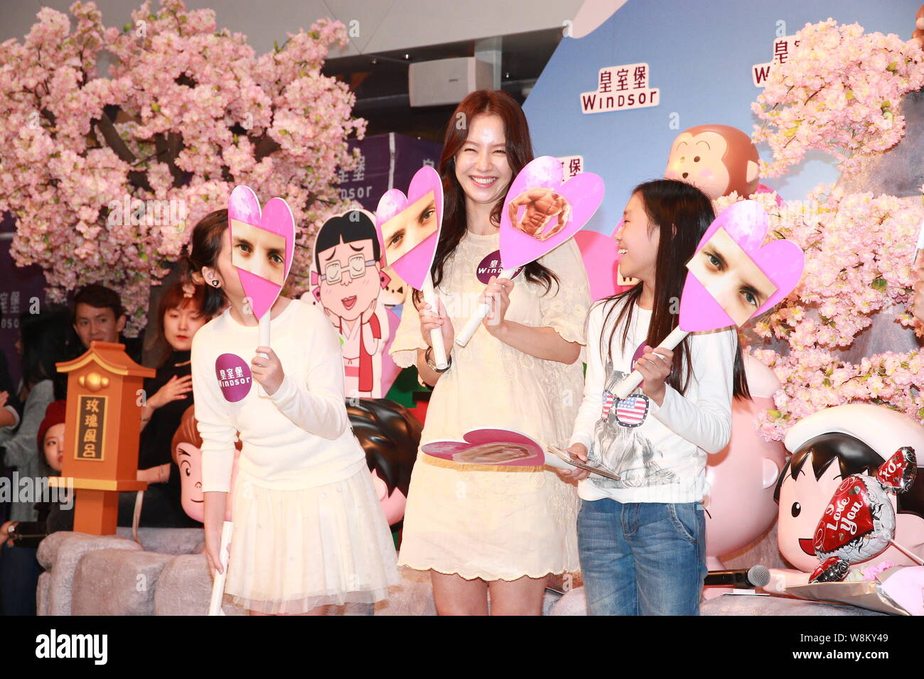 South Korean actress Cheon Seong-im, center, better known by her stage ...