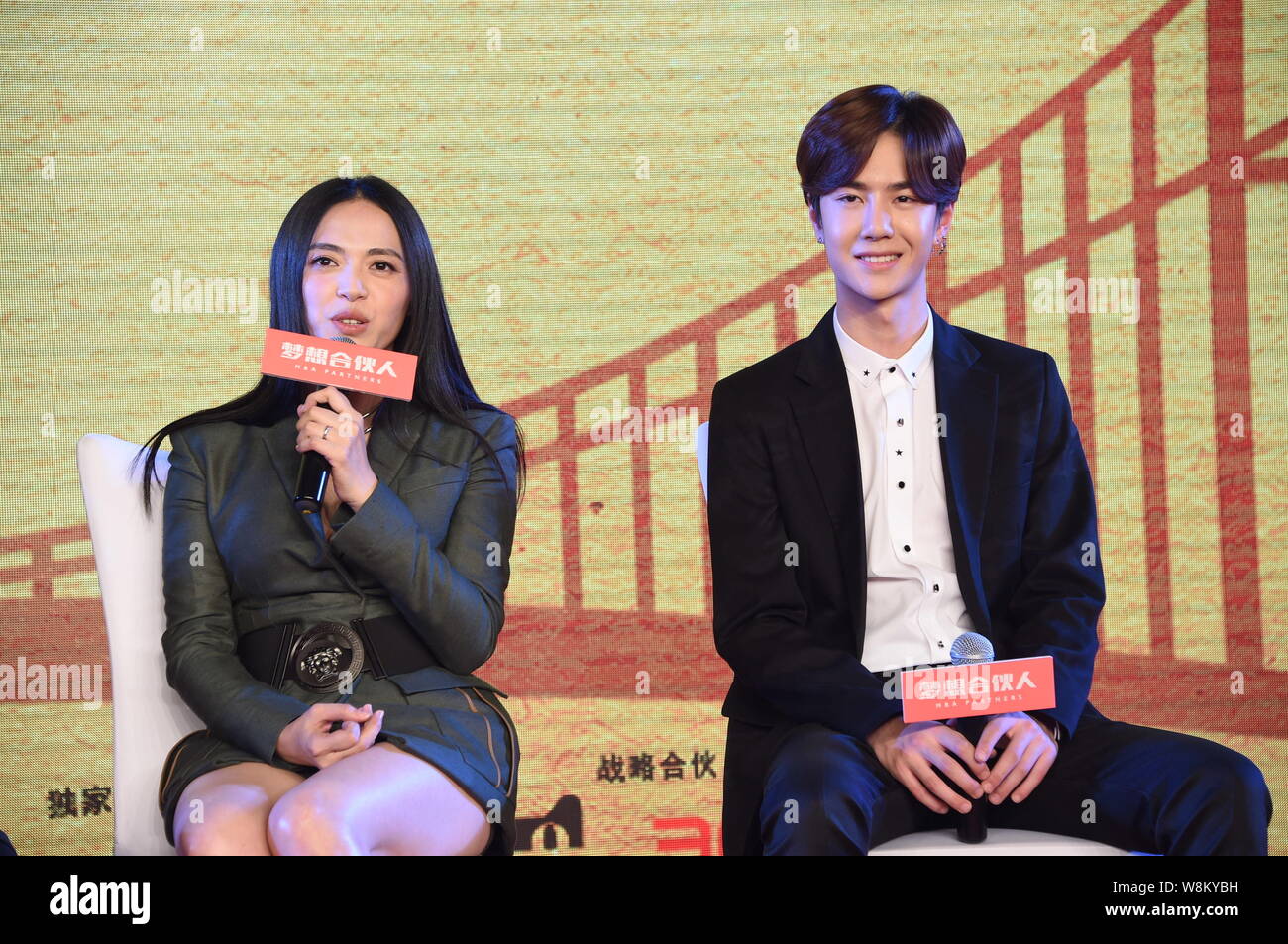 Chinese actress Yao Chen, left, speaks next to singer and actor Wang ...