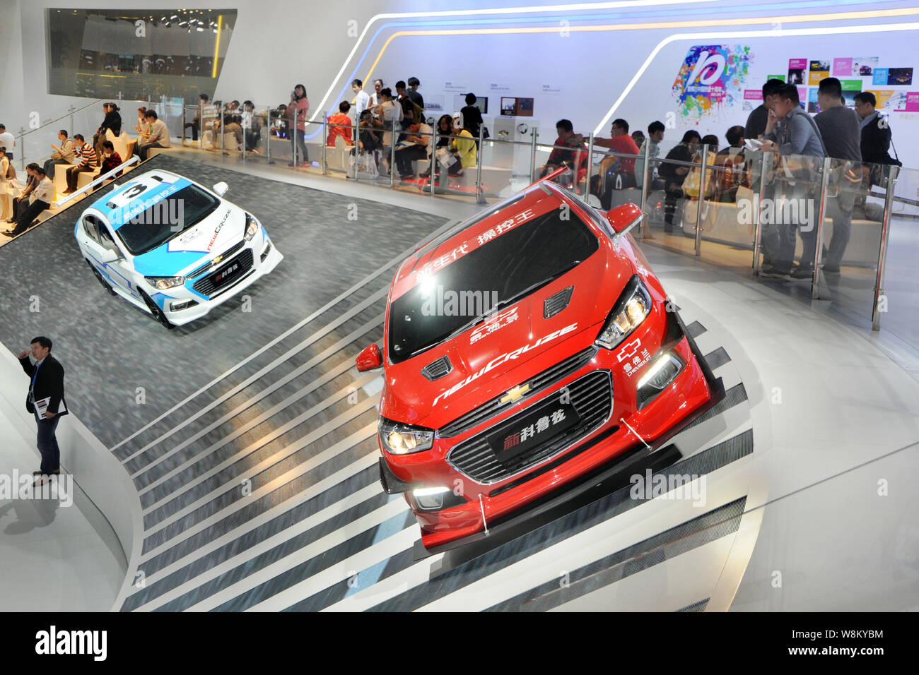 --FILE--Visitors look at Chevrolet cars of SAIC-GM, a joint venture ...