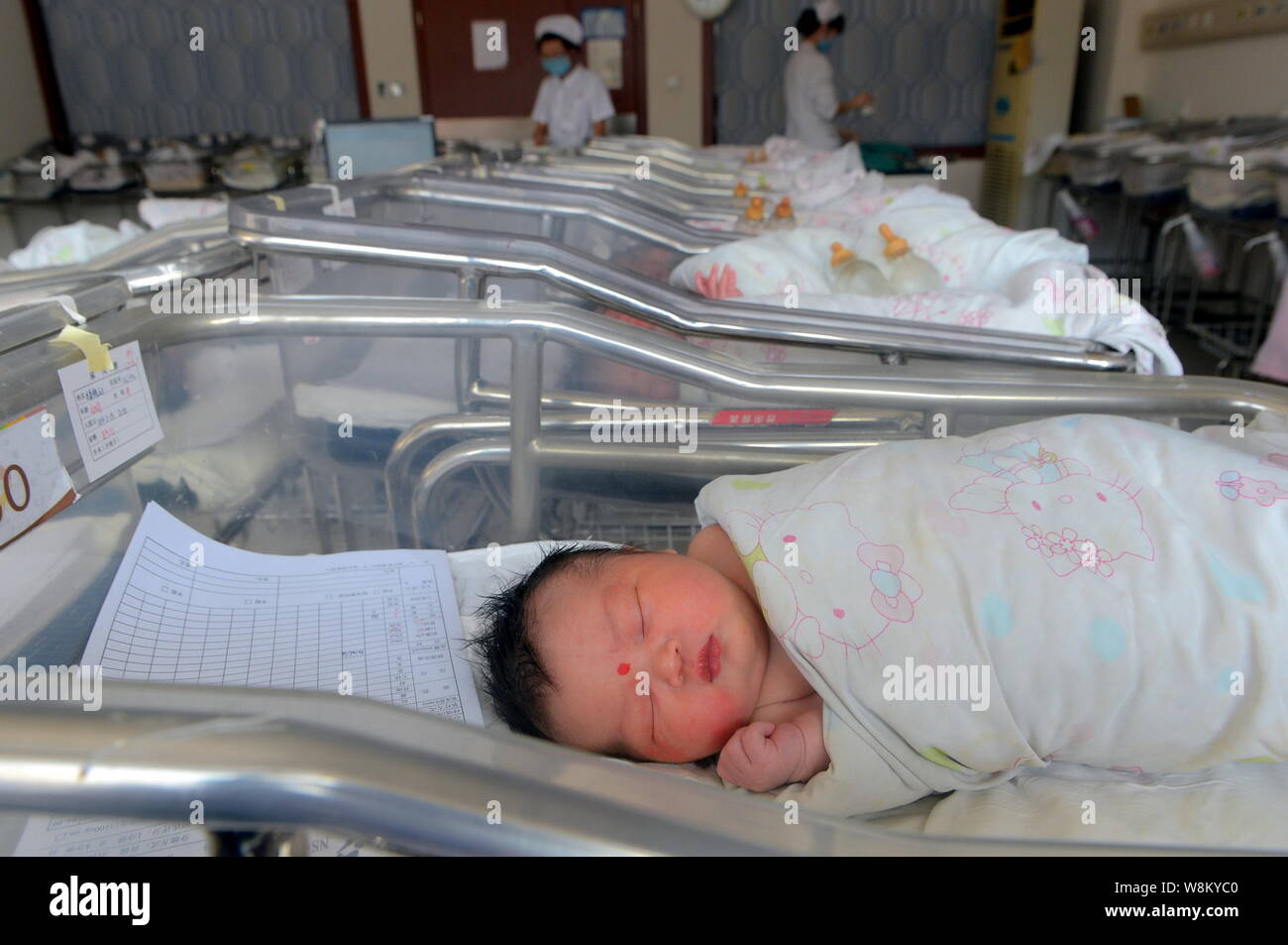 Chinese nurses take care of newborn babies at a maternity hospital in ...