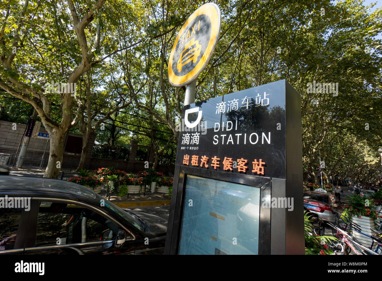 --FILE--A signboard and a taxi sign are pictured at a pick-up station ...