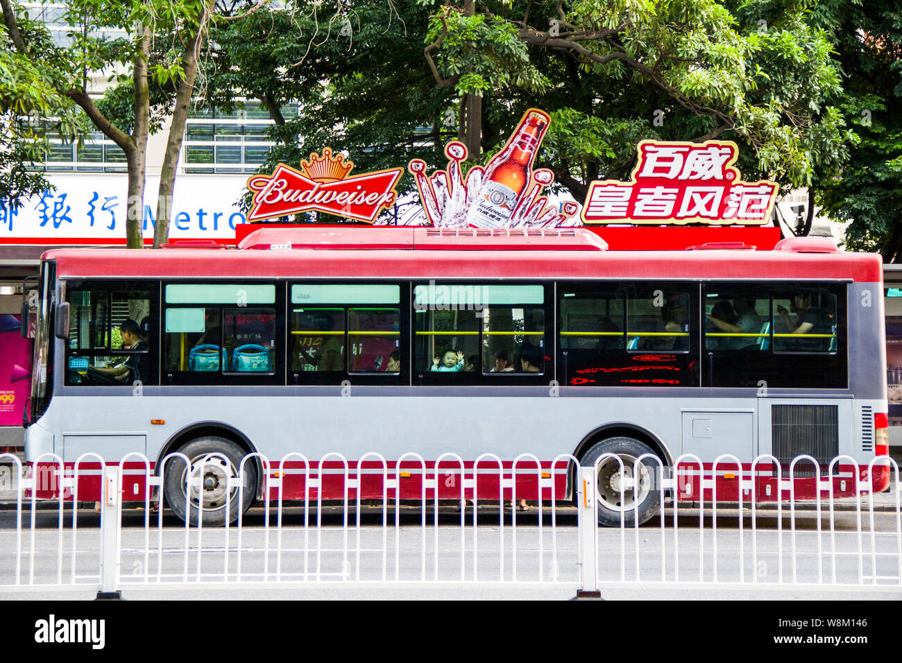 --FILE--A bus with an advertisement for AB InBev's Budweiser beer ...
