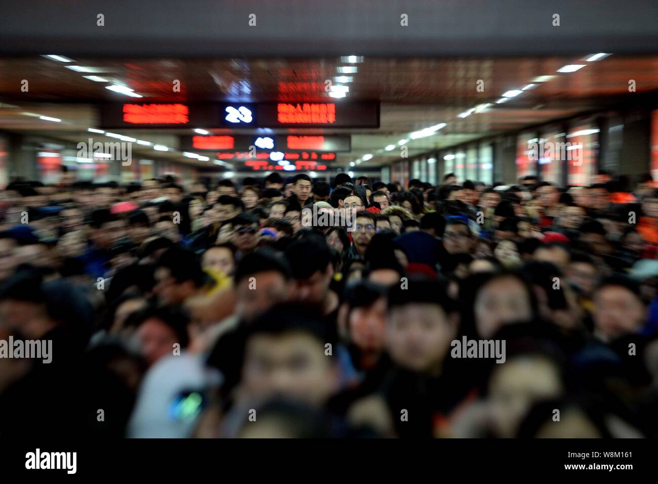 Chinese passengers who return to work from the Chinese Lunar New Year ...