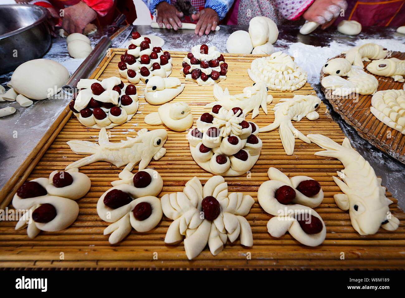 Local residents make animal-like and flower-like steamed buns to ...