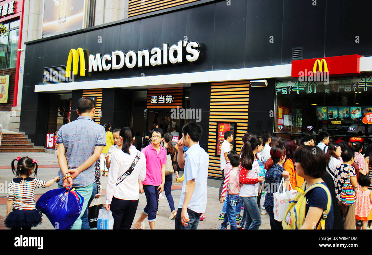 --FILE--Pedestrians walk past a fastfood restaurant of McDonald's in ...