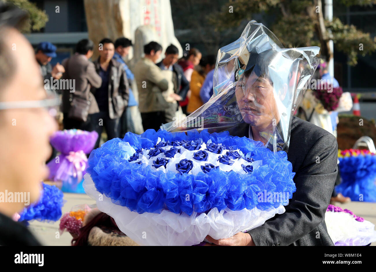 A flower trader sells bouquets of flowers for Valentine's Day at the ...