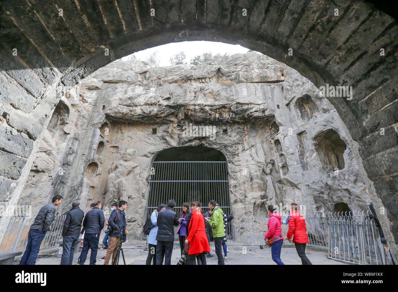 People visit the Kanjing Temple, also known as the Royal Cave Temple ...