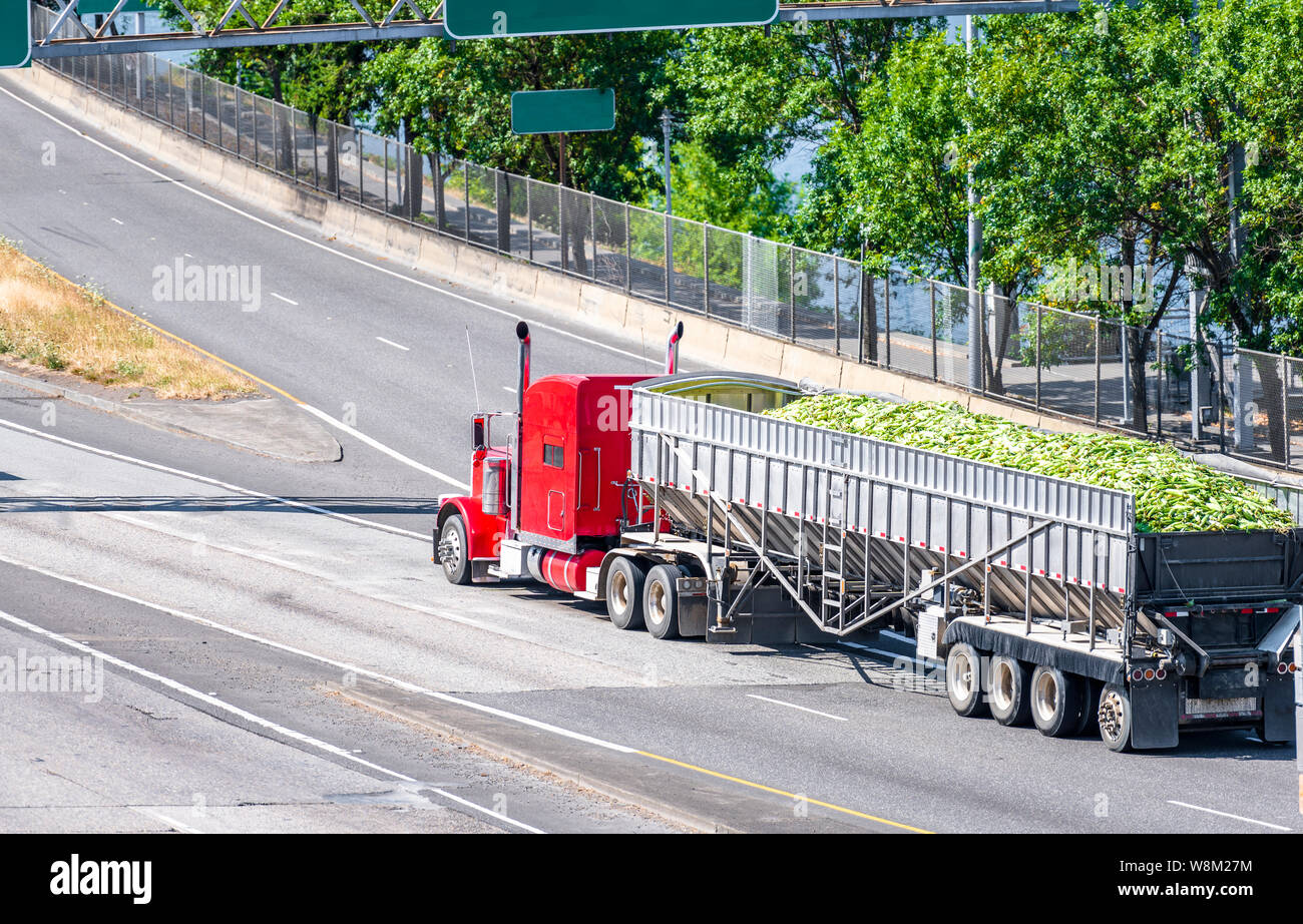 Big rig American classic red powerful semi truck with tall exhaust ...