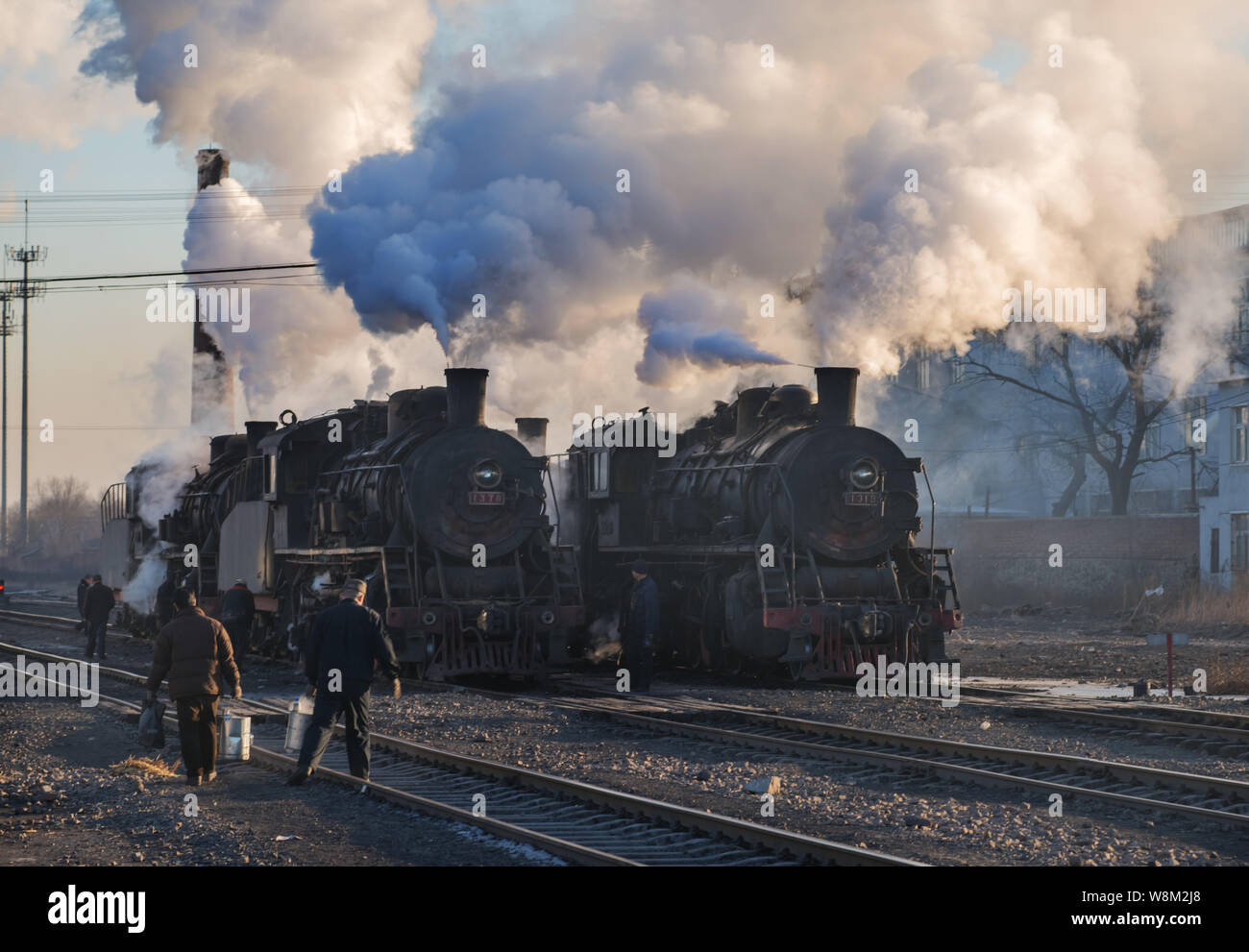 --FILE--Two steam locomotives are stopped on the track at a maintenance ...