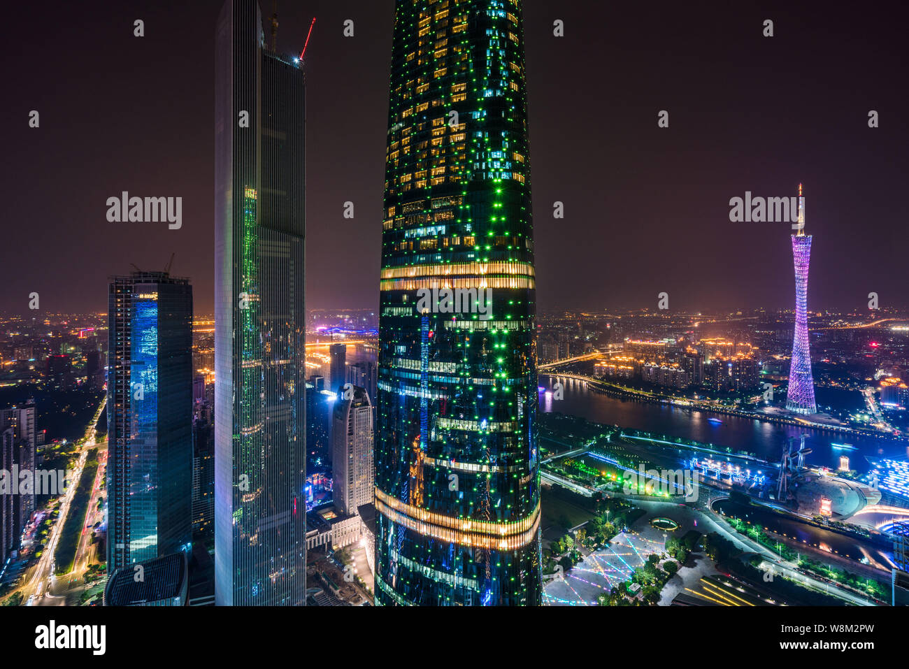 --FILE--Night view of the Canton Tower, right, and other skyscrapers ...