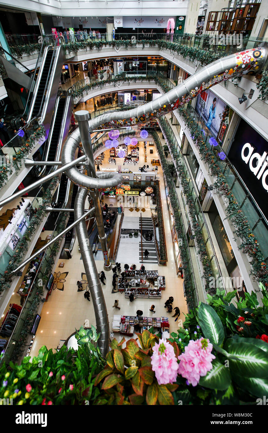 View of a five-story high giant winding slide in a shopping mall in ...