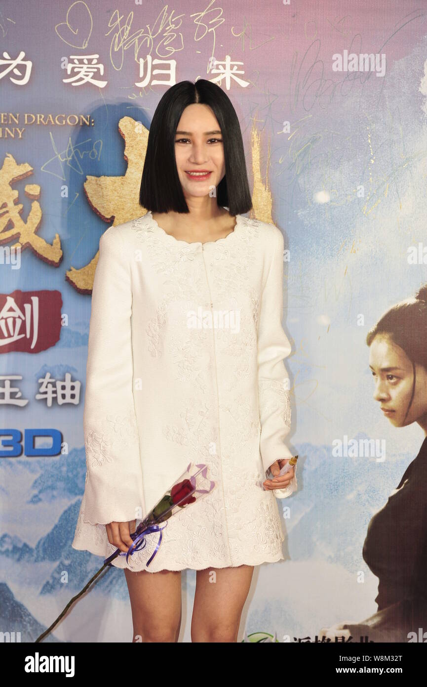 Chinese singer Shang Wenjie arrives on the red carpet for the premiere ...