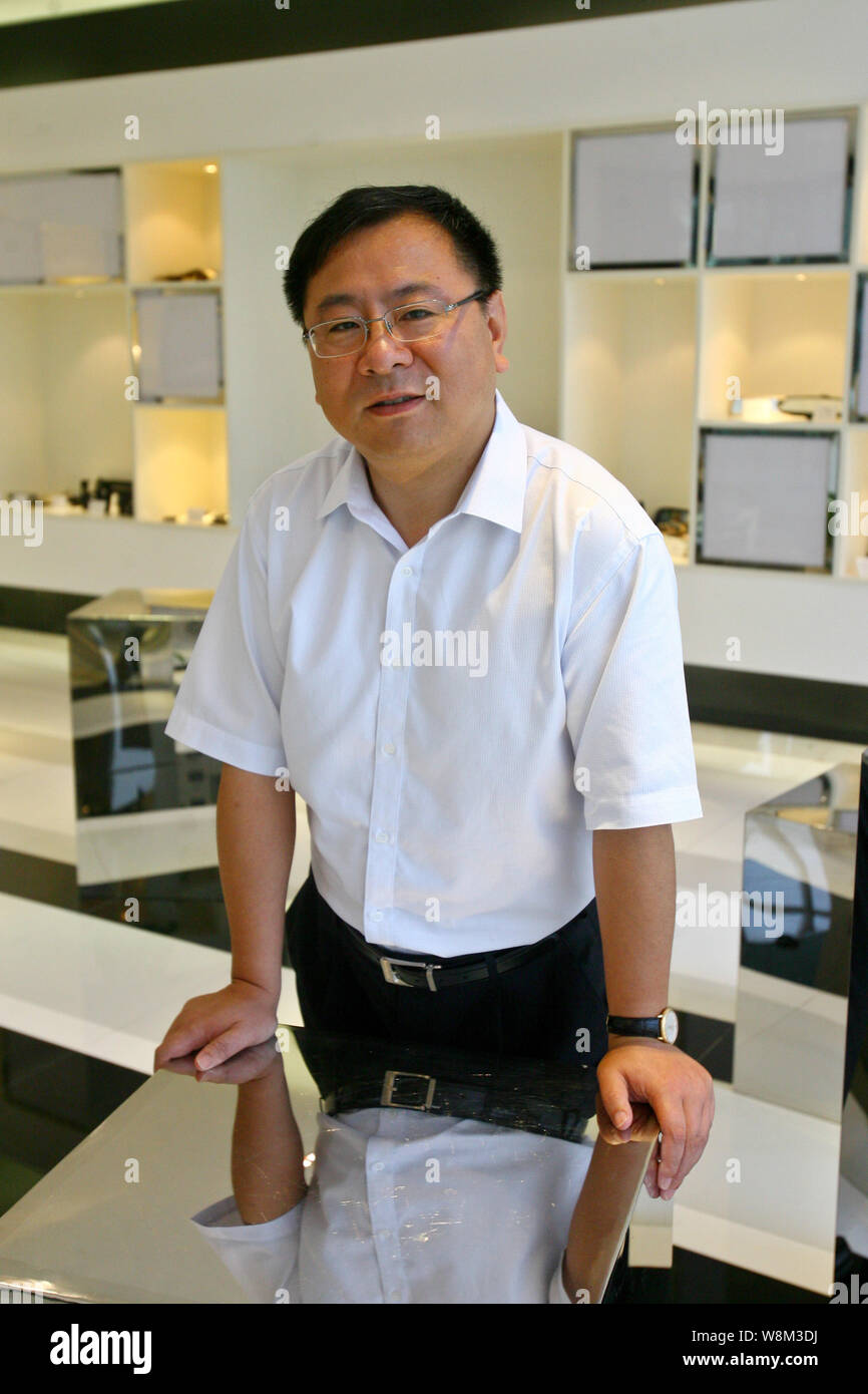 --FILE--Guo Zhiming, Vice President of Joyson Holding, poses during an ...