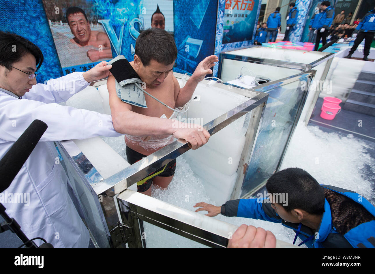 Chen Kecai, center, an "ice men" known for his ability to withstand ...