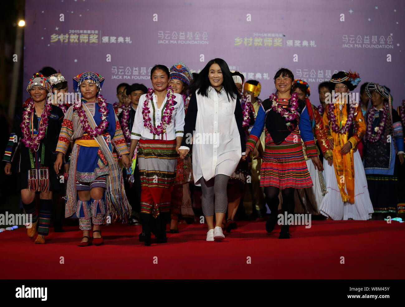 Chinese singer Na Ying, center, arrives on the red carpet for the 1st ...