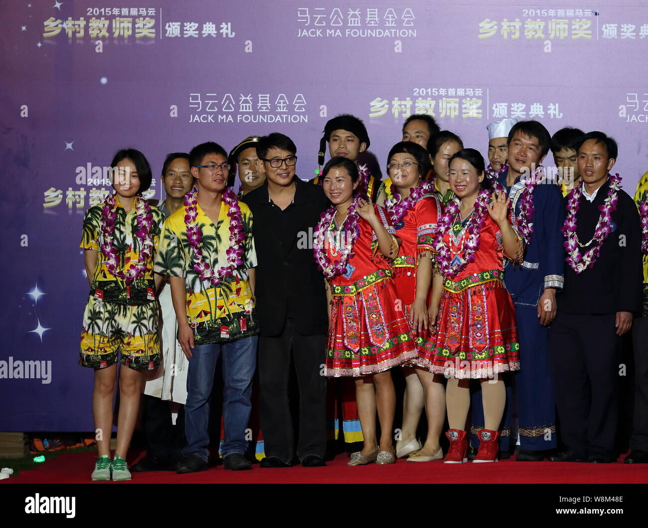 Chinese kungfu star Jet Li, third left, arrives on the red carpet for ...