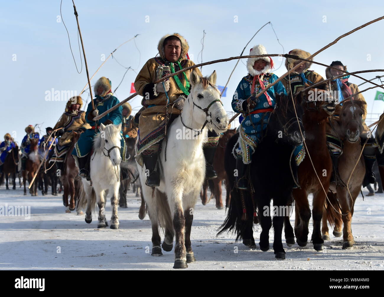 Chinese Mongolian participants ride horses at the 11th Ice and Snow ...