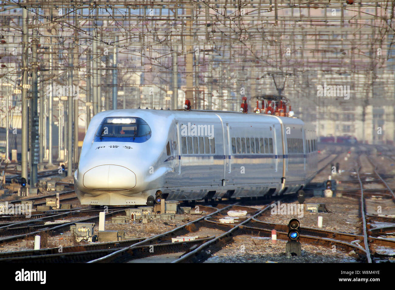 --FILE--A CRH (China Railway High-speed) bullet train drives into the Yantai Railway Station in ...