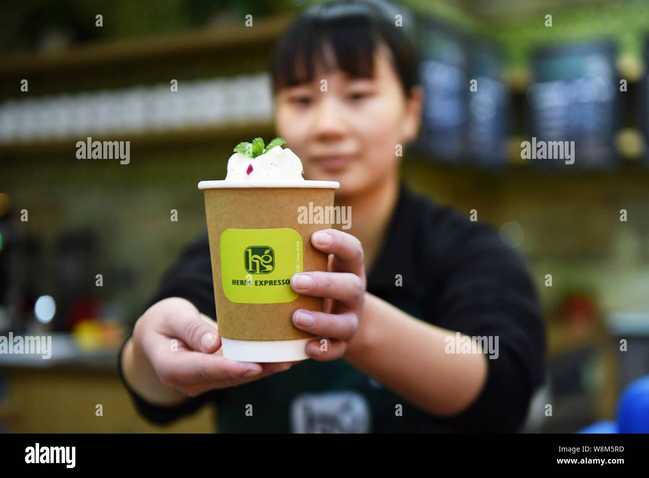 Chinese shop assistant hi-res stock photography and images - Alamy