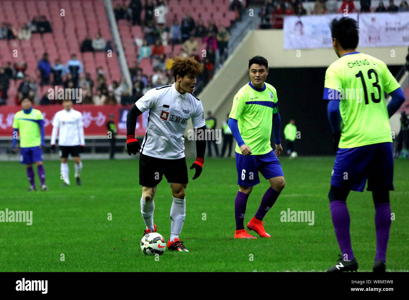 South Korean singer Kim Jong-kook, left, dribbles during the "2016 ...