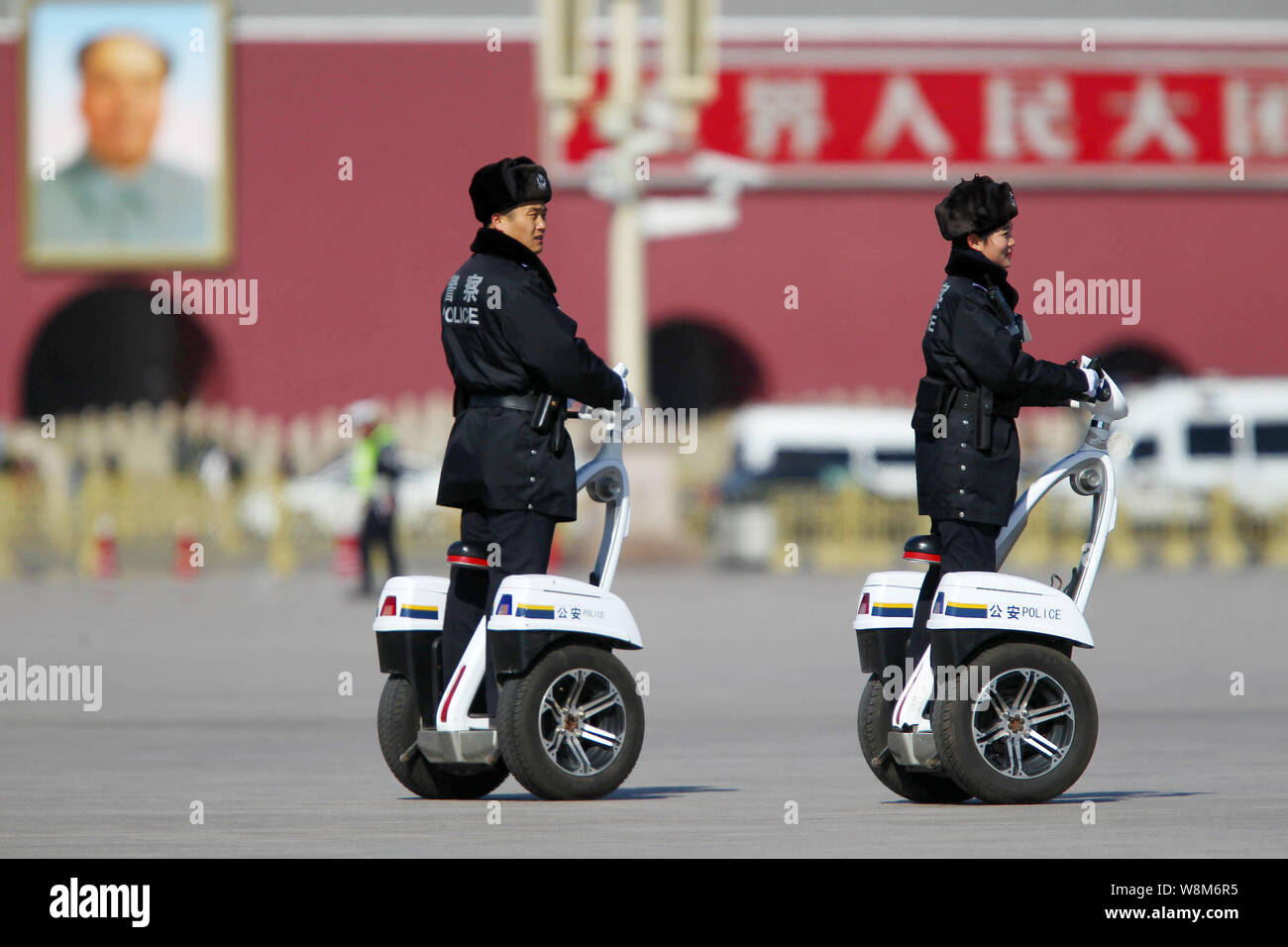 --FILE--Chinese police officers ride two-wheeled electric vehicles to ...