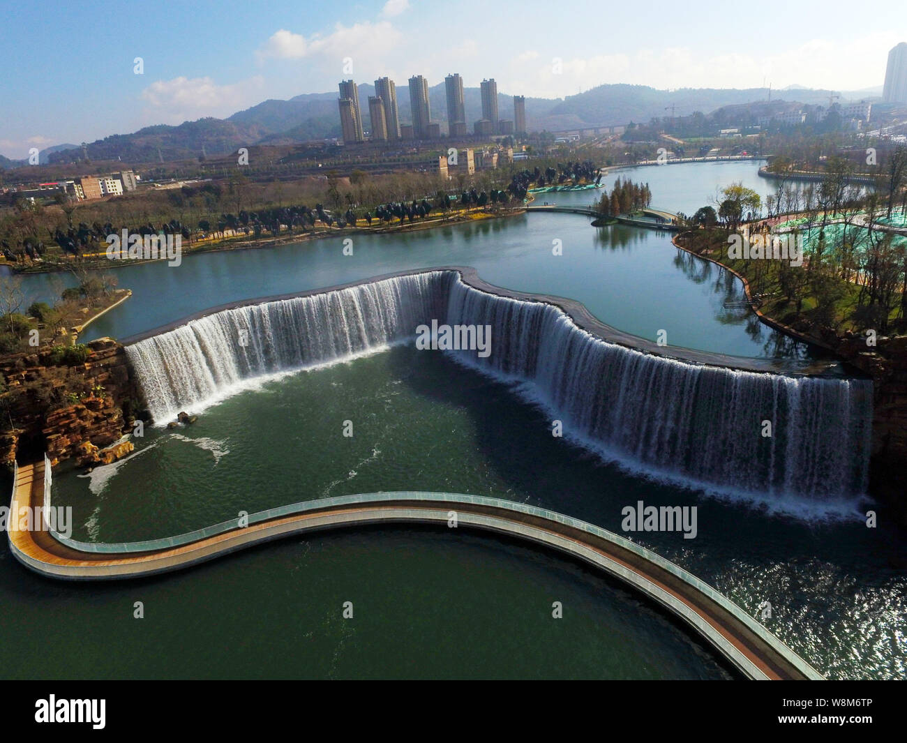 Aerial view of the manmade waterfall at the Niulanjiang Waterfall Park ...