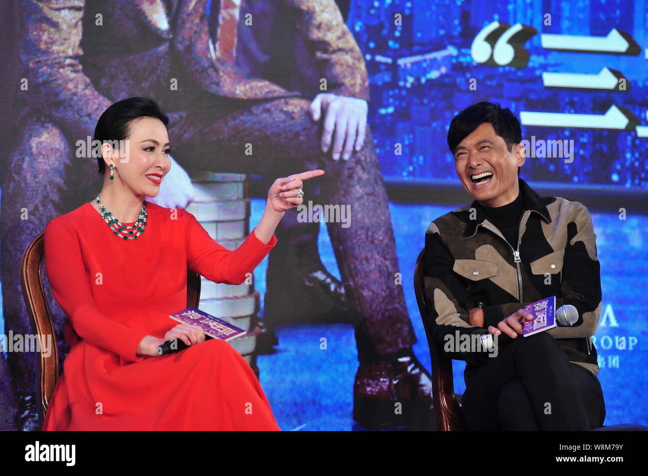 Hong Kong actress Carina Lau, left, and actor Chow Yun-fat attend a press conference to promote ...
