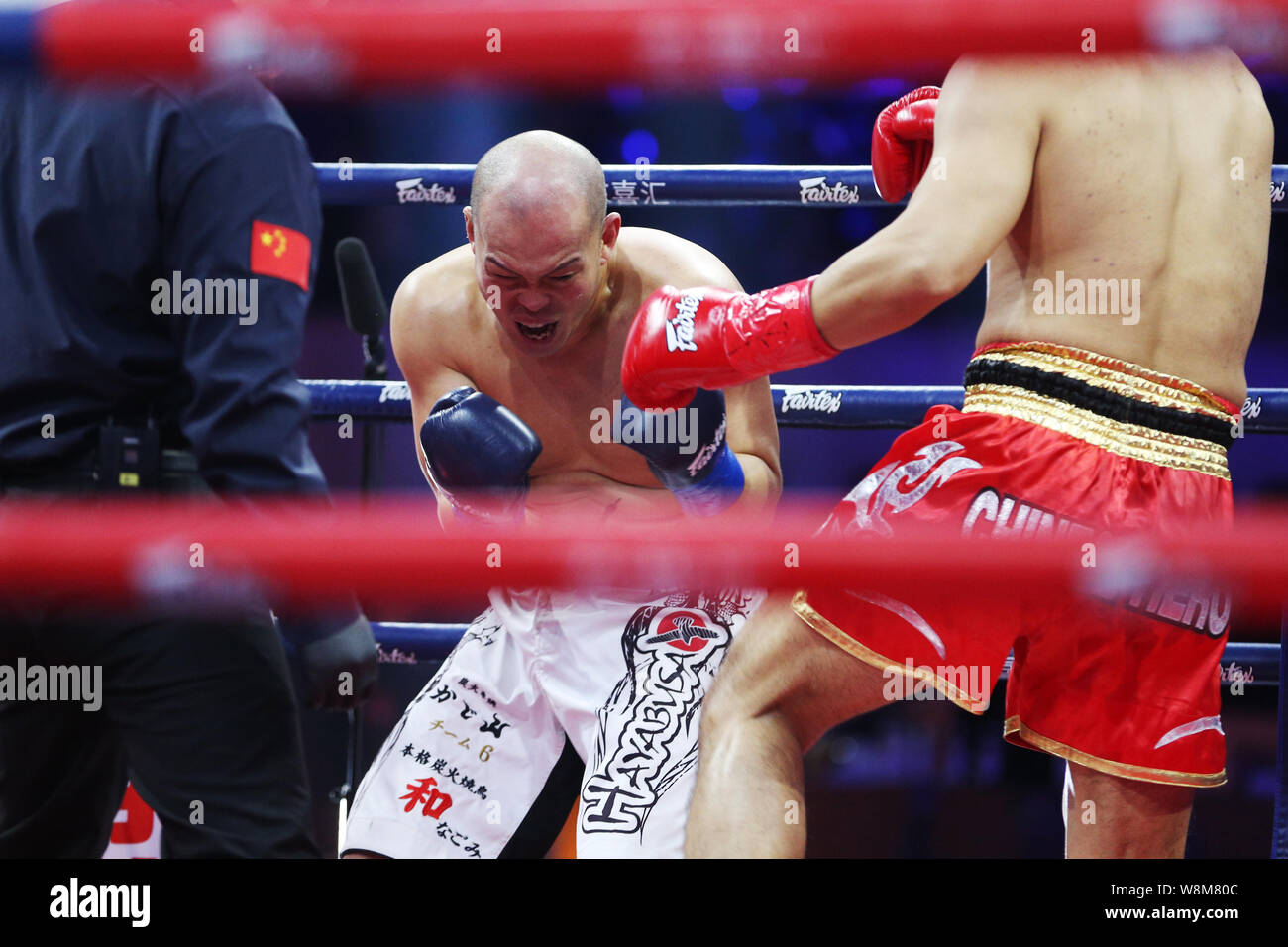Chinese boxer Wang Hongxiang, front, fights Japanese boxer KING in ...