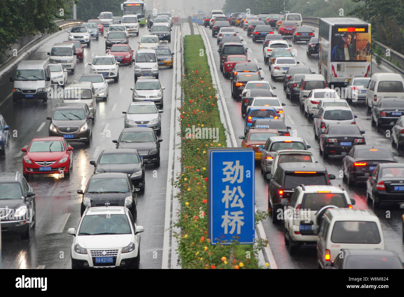 --FILE--Masses of vehicles travel on a road in Beijing, China, 29 ...
