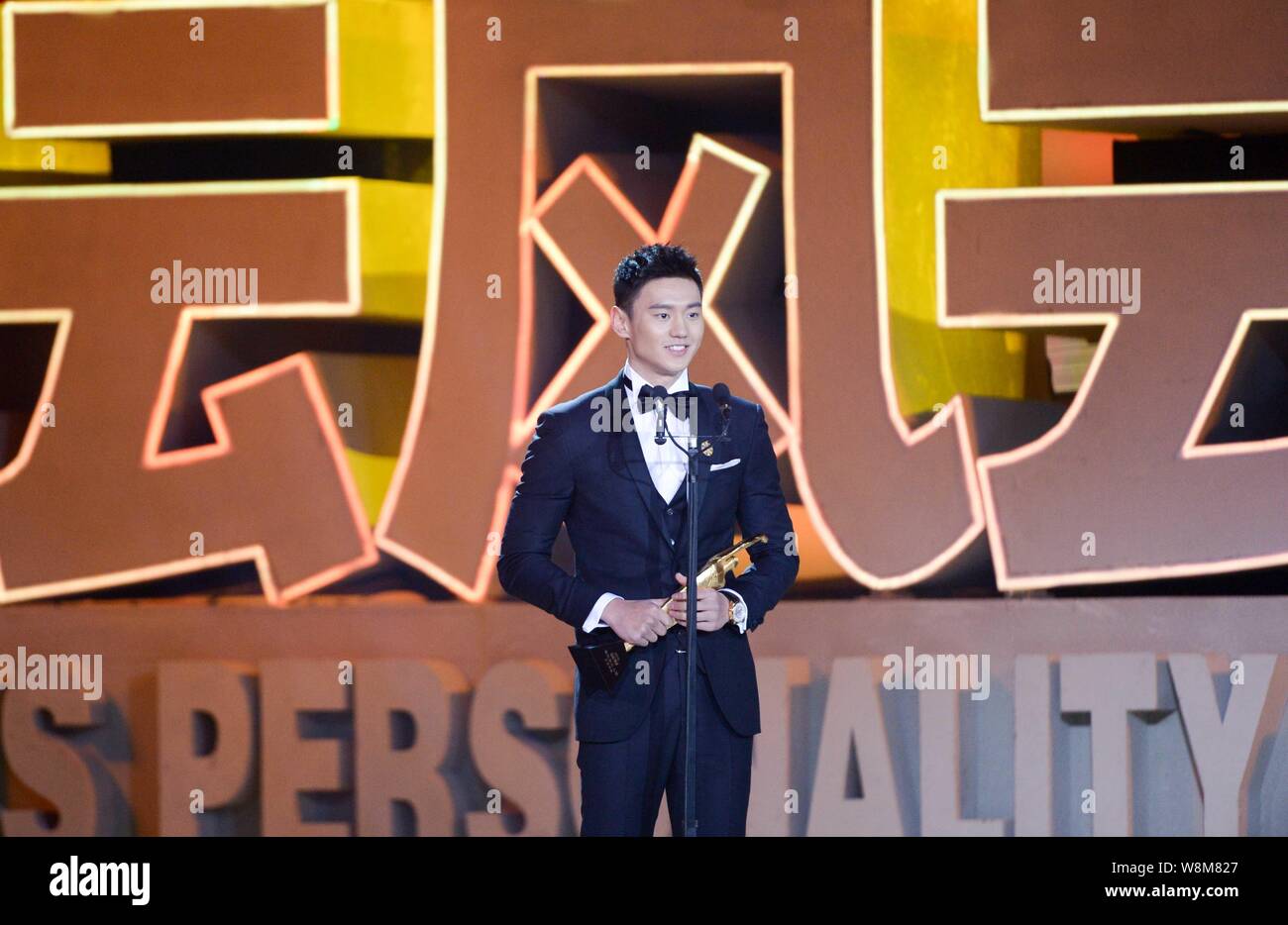 Chinese world swimming champion Ning Zetao holds his trophy for the ...