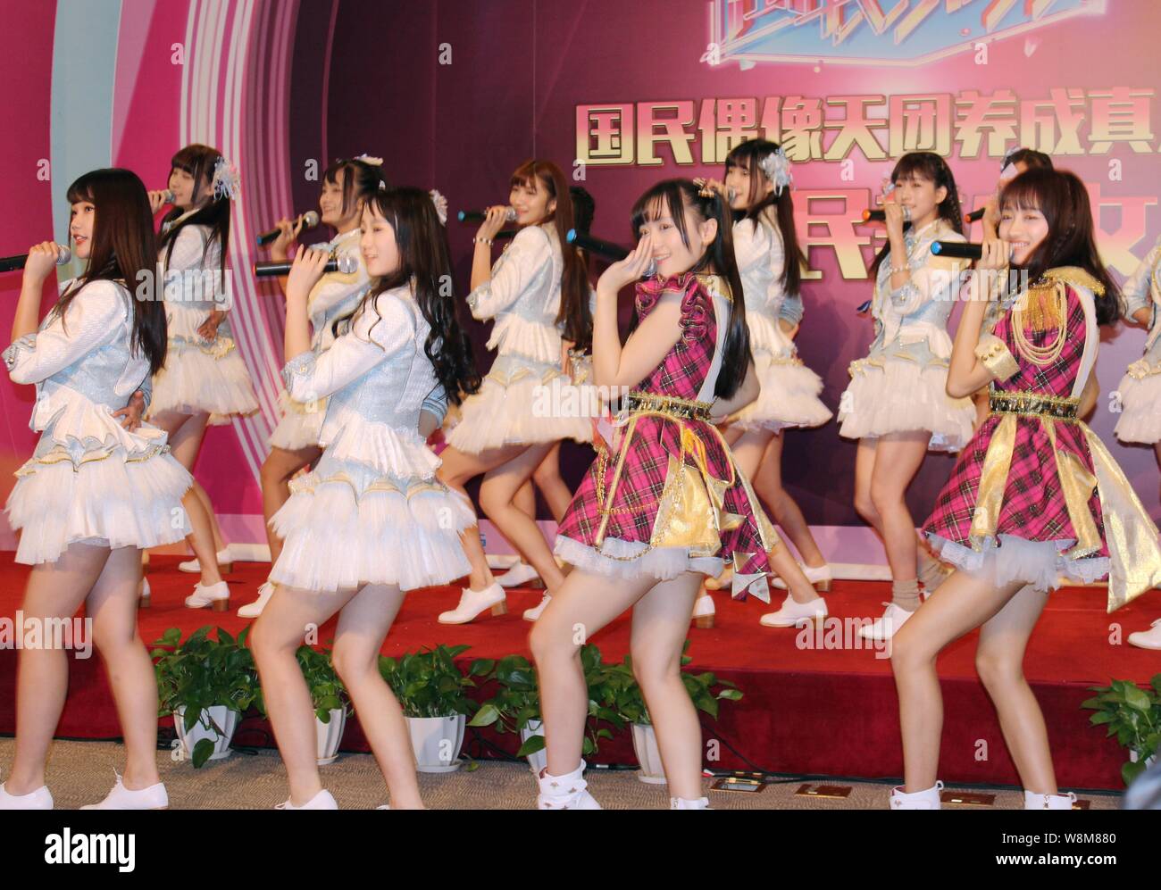 Chinese young girl group SNH48 sings and dances during a press ...