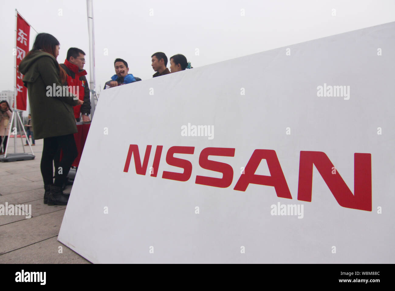 --FILE--People visit the stand of Nissan during an automobile ...