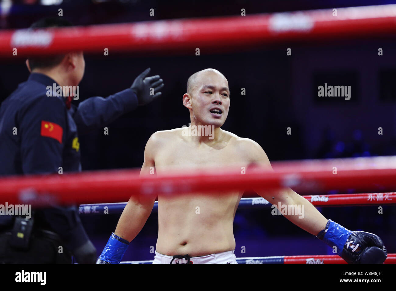 Japanese boxer KING reacts as he fights Chinese boxer Wang Hongxiang in ...