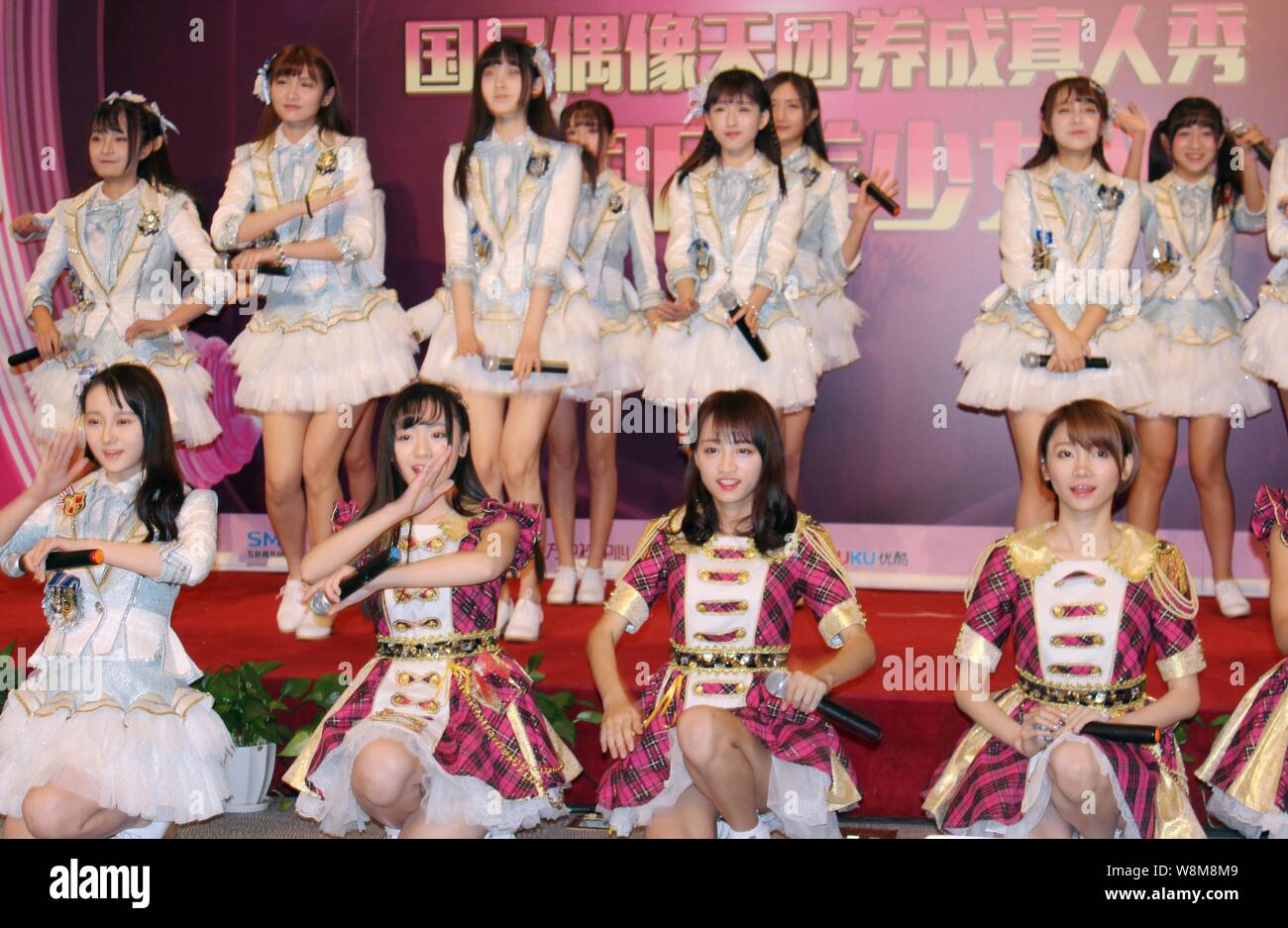 Chinese young girl group SNH48 sings and dances during a press ...