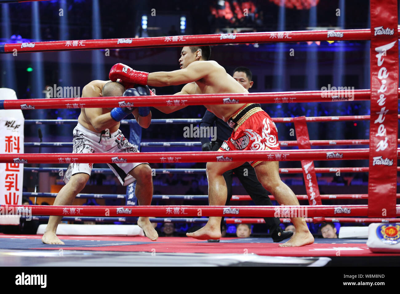 Chinese boxer Wang Hongxiang, right, fights Japanese boxer KING in ...