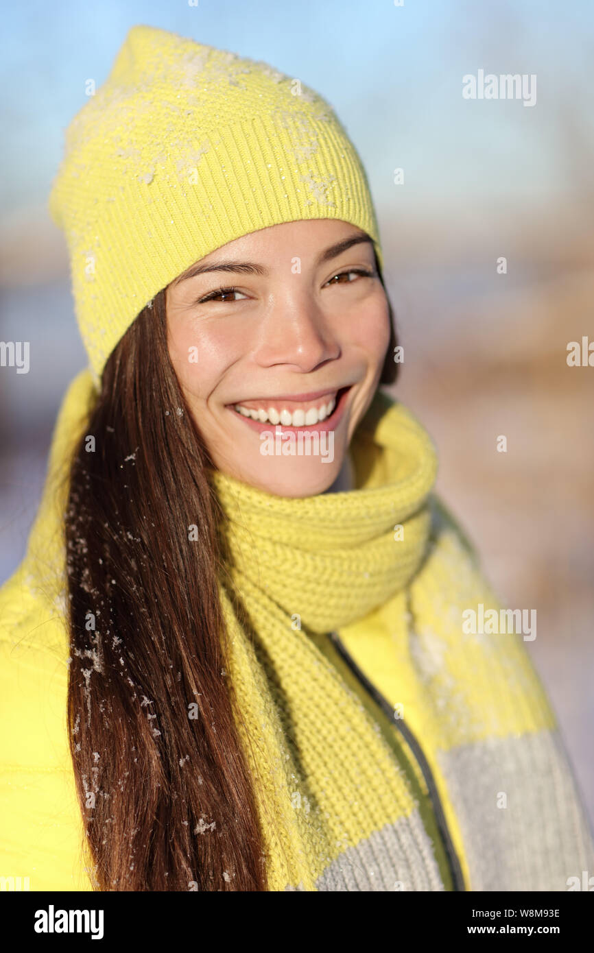 Winter season girl smiling outside in snow. Portrait of Asian woman ...