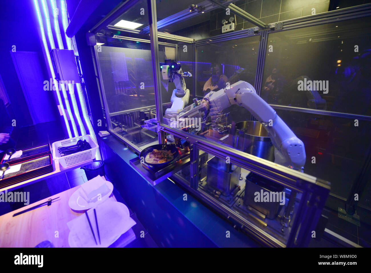 Robots Koya and Kona have finished a bow of noodles at a ramen ...