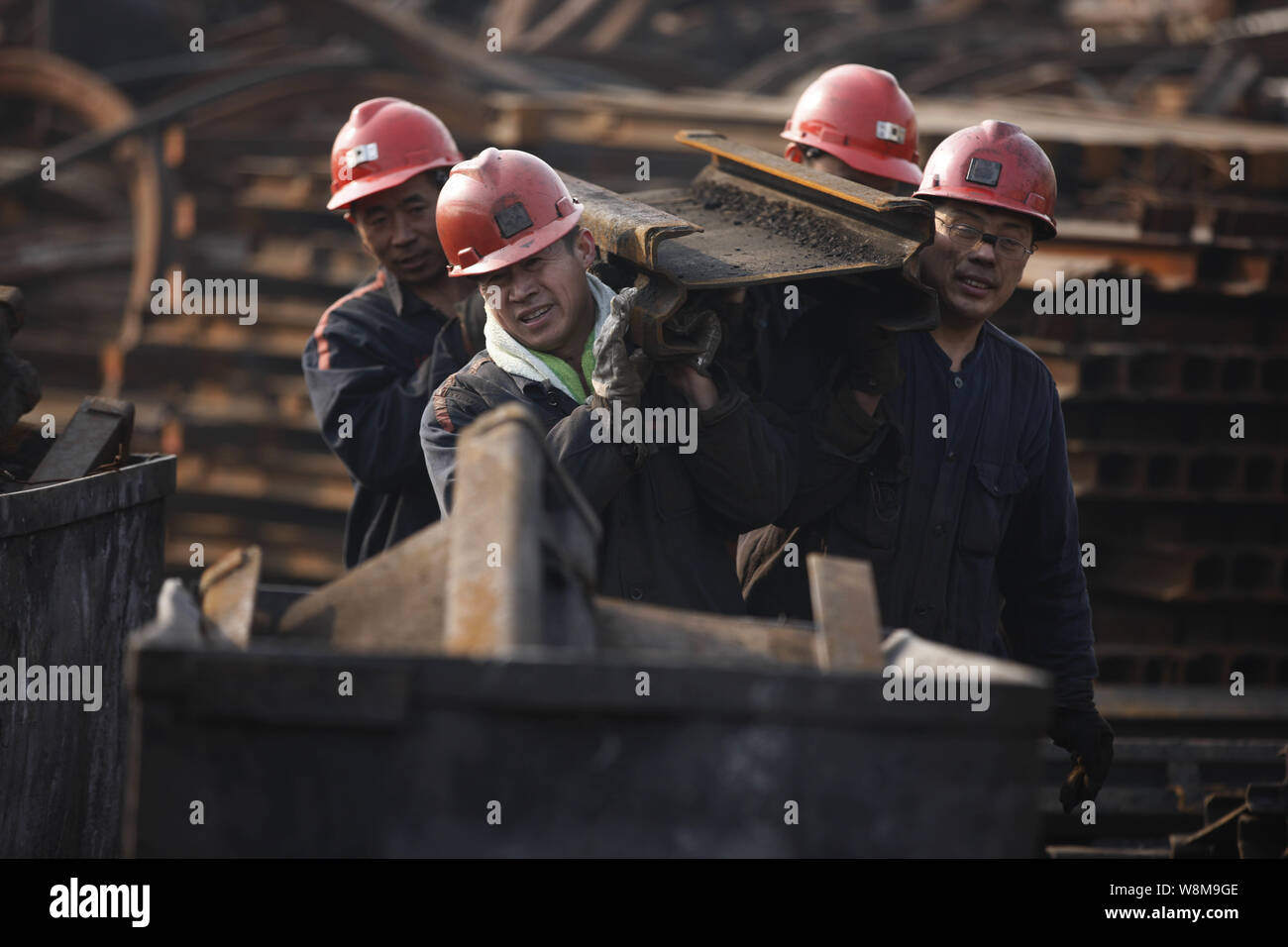 --FILE--Chinese workers carry steel at a steel factory in Huaibei city ...