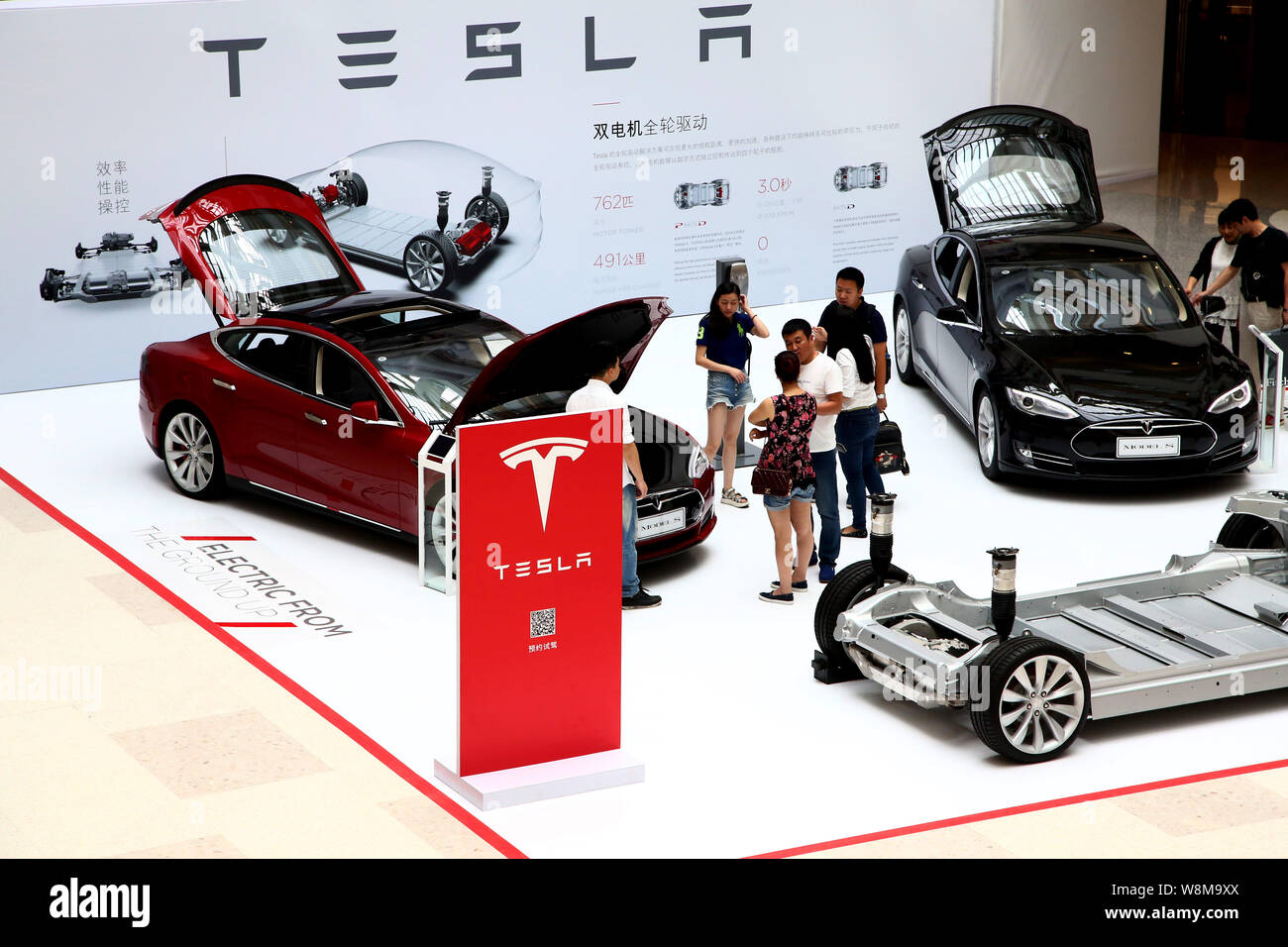 --FILE--People visit the stand of Tesla during an exhibition in ...