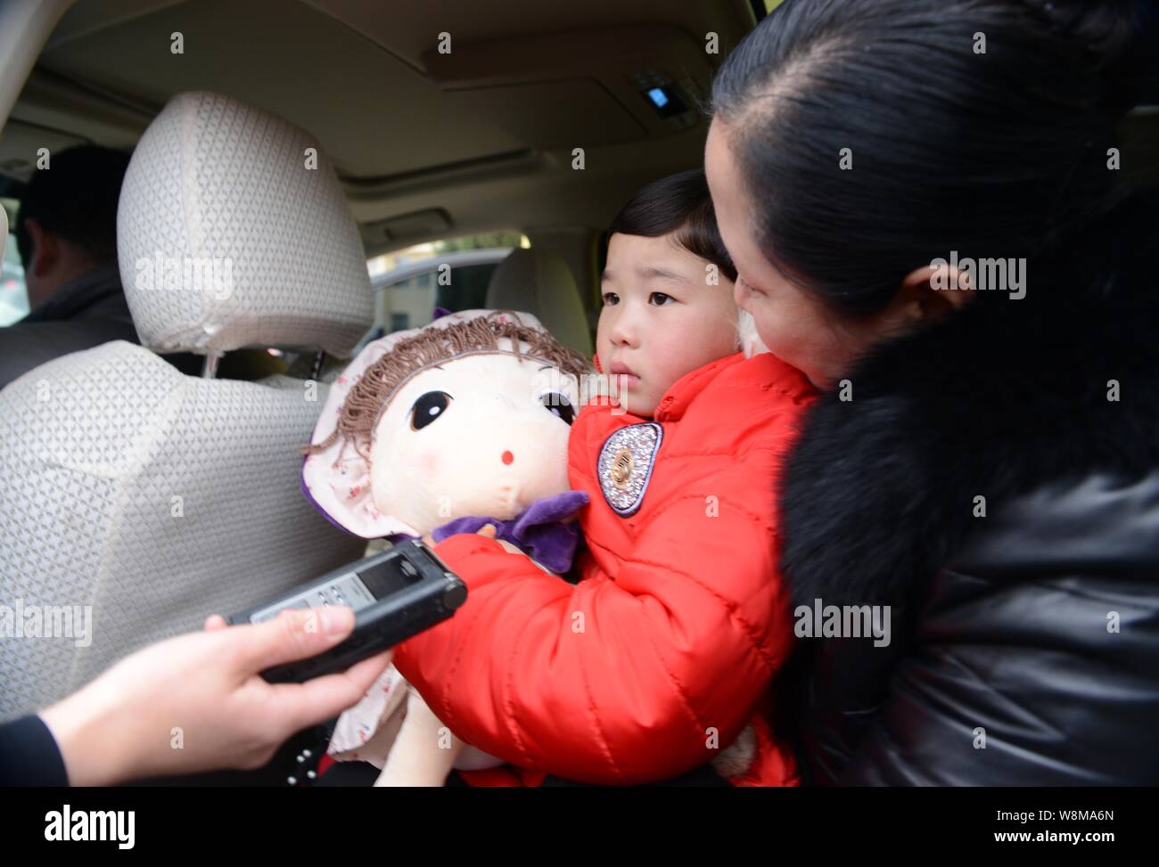 Five-year-old girl Yiran, center, who was kidnapped and later rescued ...