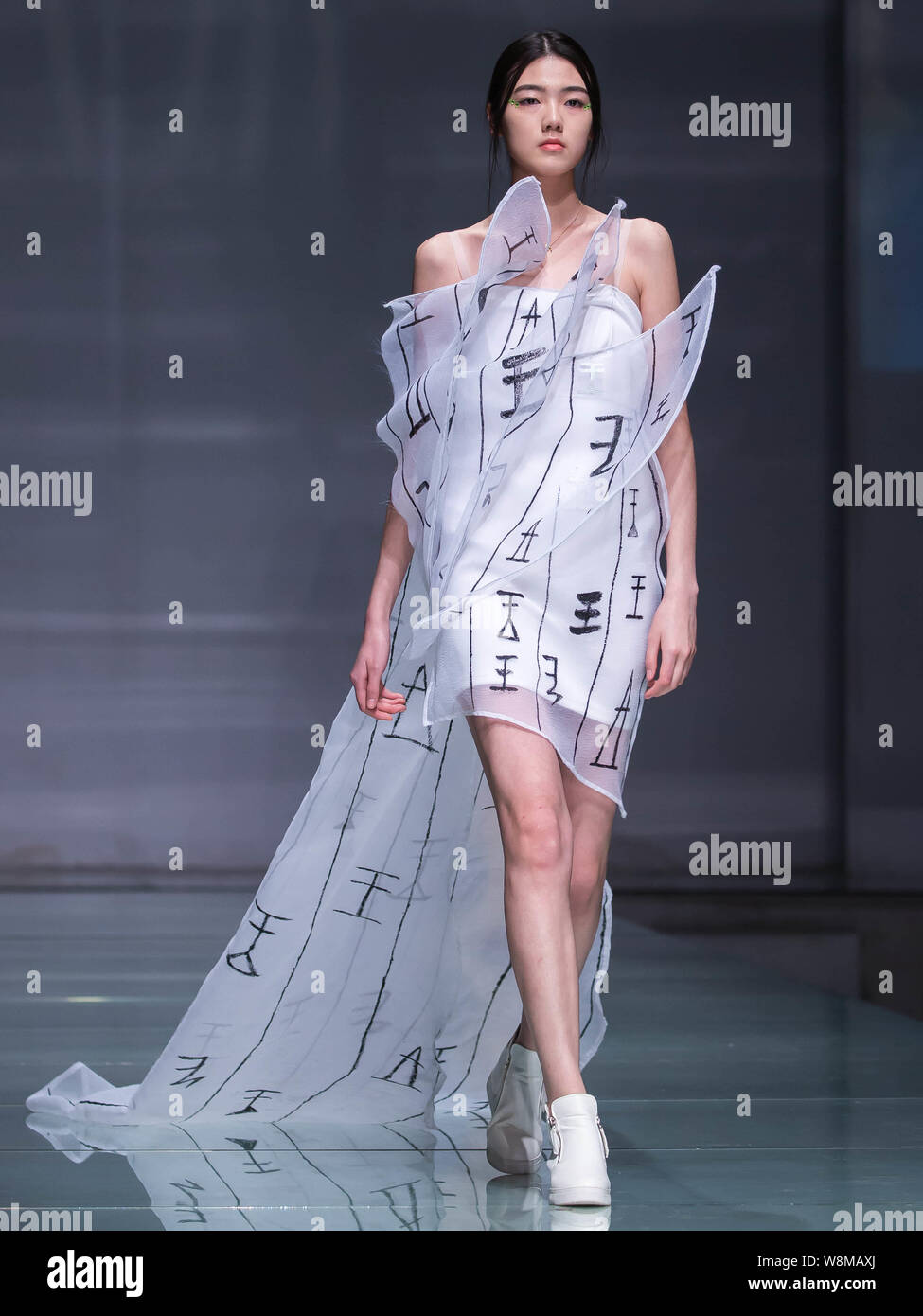 A model displays a creation designed by a student from School of ...