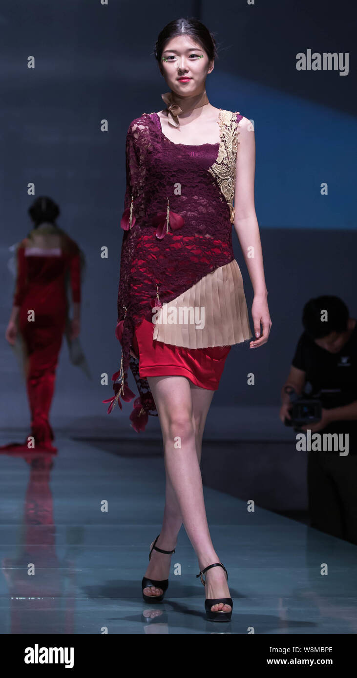 A model displays a creation designed by a student from School of ...